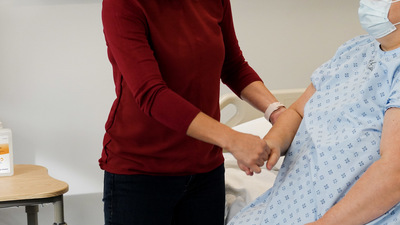 "Neurology_sitting power exam, testing tone in the arm_629" by